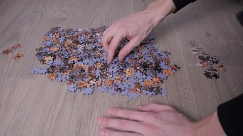 Sorting side jigsaw puzzle pieces. | Stock Video | Pond5