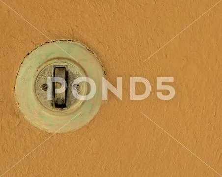 Soviet old style electric switch installed in the wall Stock Photo ...