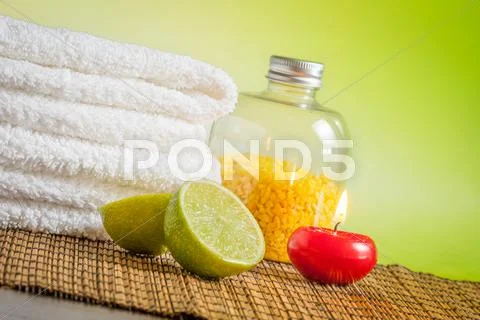 Spa massage border background with towel stacked red candle and lime ...