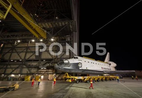 Space shuttle Atlantis is seen as it rolls out of the Vehicle Assembly ...