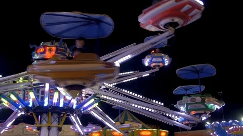 Spaceship carousel in night amusement pa... | Stock Video | Pond5