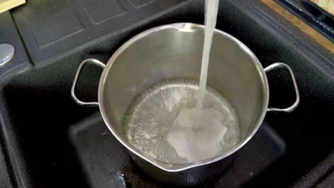 Spaghetti, pouring water into the pot wh... | Stock Video | Pond5