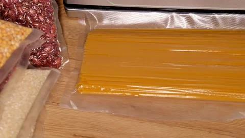 Spaghetti in a vacuum bag. Vacuum spaghe... | Stock Video | Pond5
