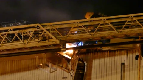 Sparkles at structure fire with flames a... | Stock Video | Pond5