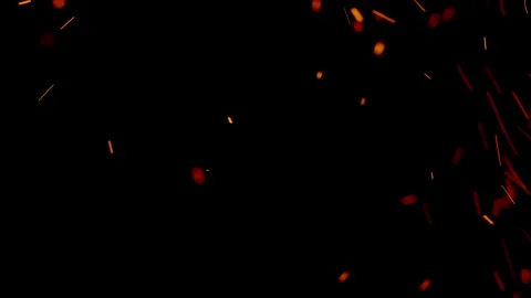 Sparkling glowing ember particles on Bl... | Stock Video | Pond5