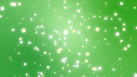 Sparkly particles moving across a green... | Stock Video | Pond5