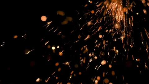 Sparks falling against a black backgroun... | Stock Video | Pond5