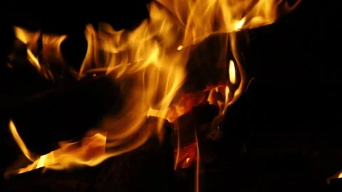 Sparks flying from a fire on a dark back... | Stock Video | Pond5