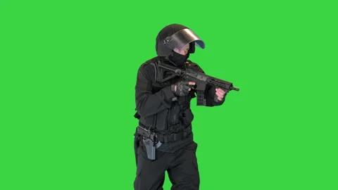 Spec ops soldier in black uniform aiming... | Stock Video | Pond5