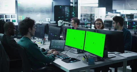 Specialist Working on Computer with Gree... | Stock Video | Pond5