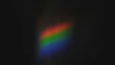 Spectrum glares of the sun on the black ... | Stock Video | Pond5