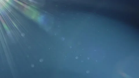 Spectrum lens flare and floating particl... | Stock Video | Pond5