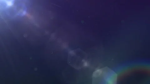 Spectrum lens flare and particles on gre... | Stock Video | Pond5