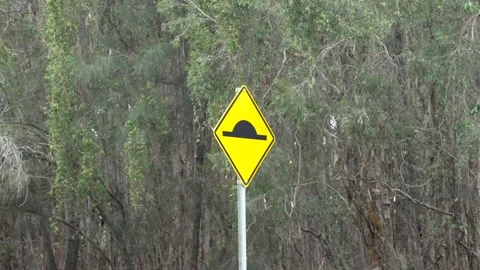 Speed bump sign, warning black on yellow... | Stock Video | Pond5