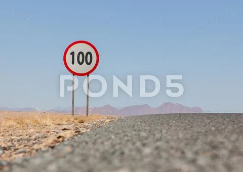 Speed limit sign at a desert road in Namibia Stock Photo #55117830