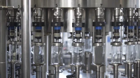 Spill of vodka in glass bottles at the p... | Stock Video | Pond5