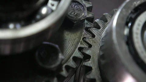 Spinning choppers of two wide cogs going... | Stock Video | Pond5