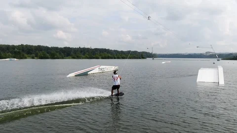 Spinning moves on a big ramp, wakeboardi... | Stock Video | Pond5