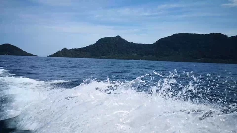 Splashing water on sea from the moving b... | Stock Video | Pond5