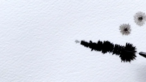 Splattering black ink on white paper tex... | Stock Video | Pond5