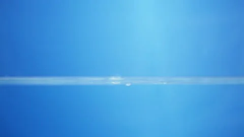 Splattering water creating tiny droplets... | Stock Video | Pond5