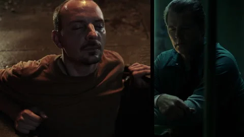 Split screen of two inmates planning an ... | Stock Video | Pond5