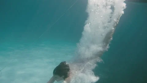 Split shot, camera emerges, half above, ... | Stock Video | Pond5