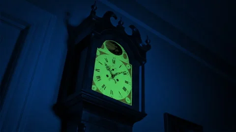 Spooky Green Clock Face Lights Up At Nig... | Stock Video | Pond5