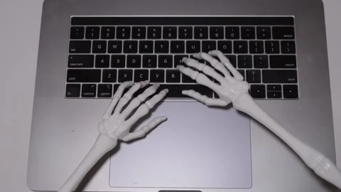 Spooky typing session with skeleton hand... | Stock Video | Pond5