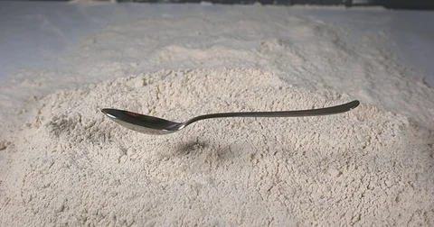 Spoon Falling on Flour, Slow Motion 4K | Stock Video | Pond5