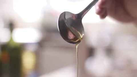 Spoon oil drip, cooking oil, vegetable o... | Stock Video | Pond5