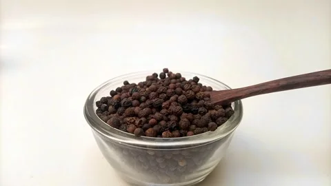 Spoon out of Black pepper from the glass... | Stock Video | Pond5