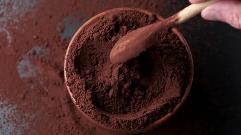 Spoon scooping cocoa powder from bowl on... | Stock Video | Pond5