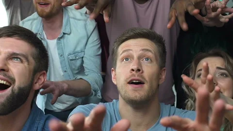 Sport fans shaking fingers, chanting slo... | Stock Video | Pond5