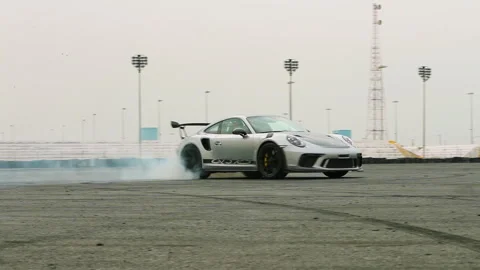 Sports car spinning around doing donuts ... | Stock Video | Pond5