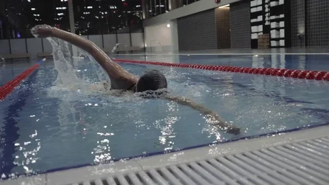 Sports woman swimmer swimming and get ou... | Stock Video | Pond5