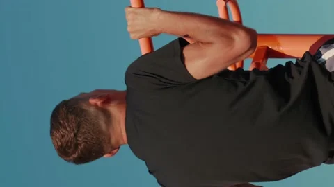 Sportsman doing pull ups exercises on gy... | Stock Video | Pond5