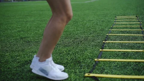 Sporty girl doing exercises on the agili... | Stock Video | Pond5