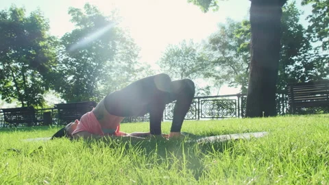 Sporty woman tries to balance on bridge ... | Stock Video | Pond5