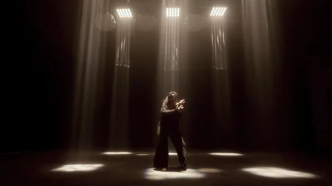 Spotlight On Woman Dancing In Dim Studio | Stock Video | Pond5