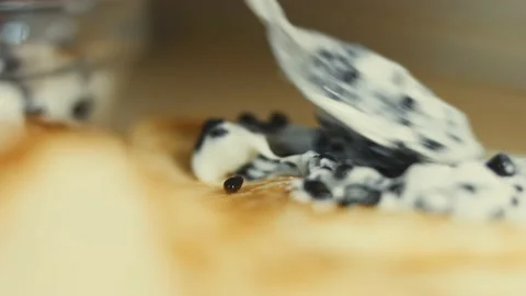 Spreading lump fish black roe with taram... | Stock Video | Pond5