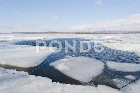 Photograph: Spring ice drifting on the river. Background texture ...