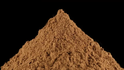 Sprinkle cinnamon powder on black backgr... | Stock Video | Pond5