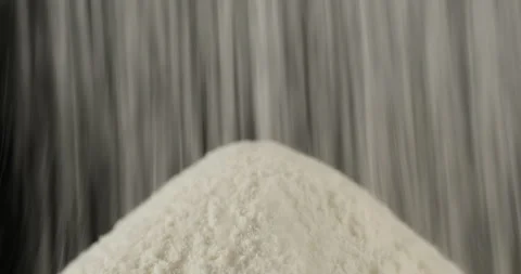 Sprinkle white flour powder on heap, iso... | Stock Video | Pond5