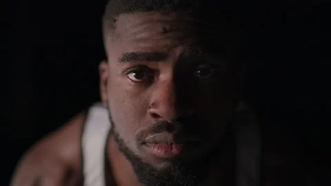 Sprinter Looking up While in the Blocks | Stock Video | Pond5