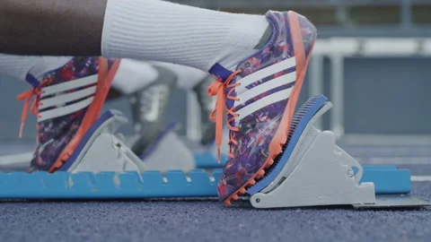 Sprinters Stand In Blocks On Track | Stock Video | Pond5