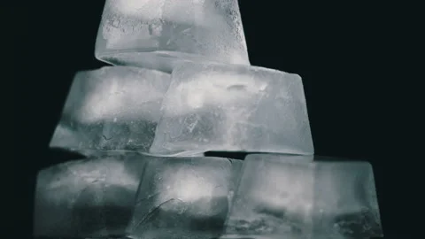 Square Ice Cubes are Spinning on a Black... | Stock Video | Pond5