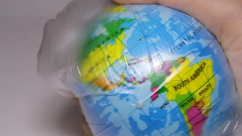 Squeeze the World wrapped in plastic. Pl... | Stock Video | Pond5