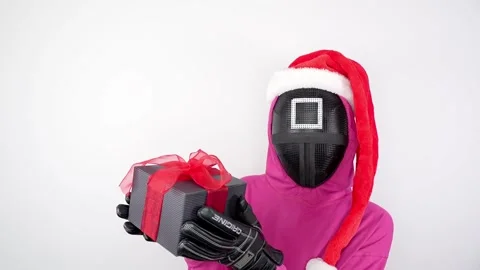 Squid Game pink guard with Christmas hat... | Stock Video | Pond5