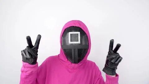 Squid Game pink guard dancing with hands... | Stock Video | Pond5